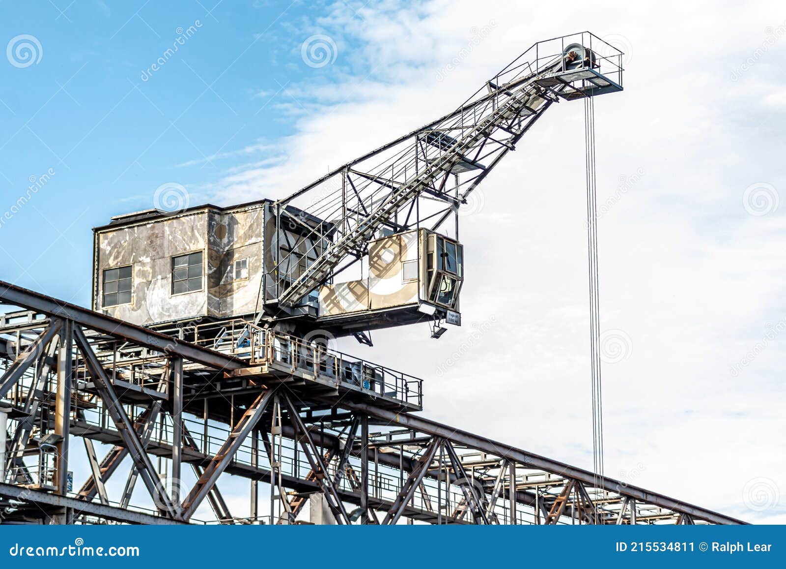 A Freight Yard Crane Unloading Ship Containers Stock Image - Image of ...