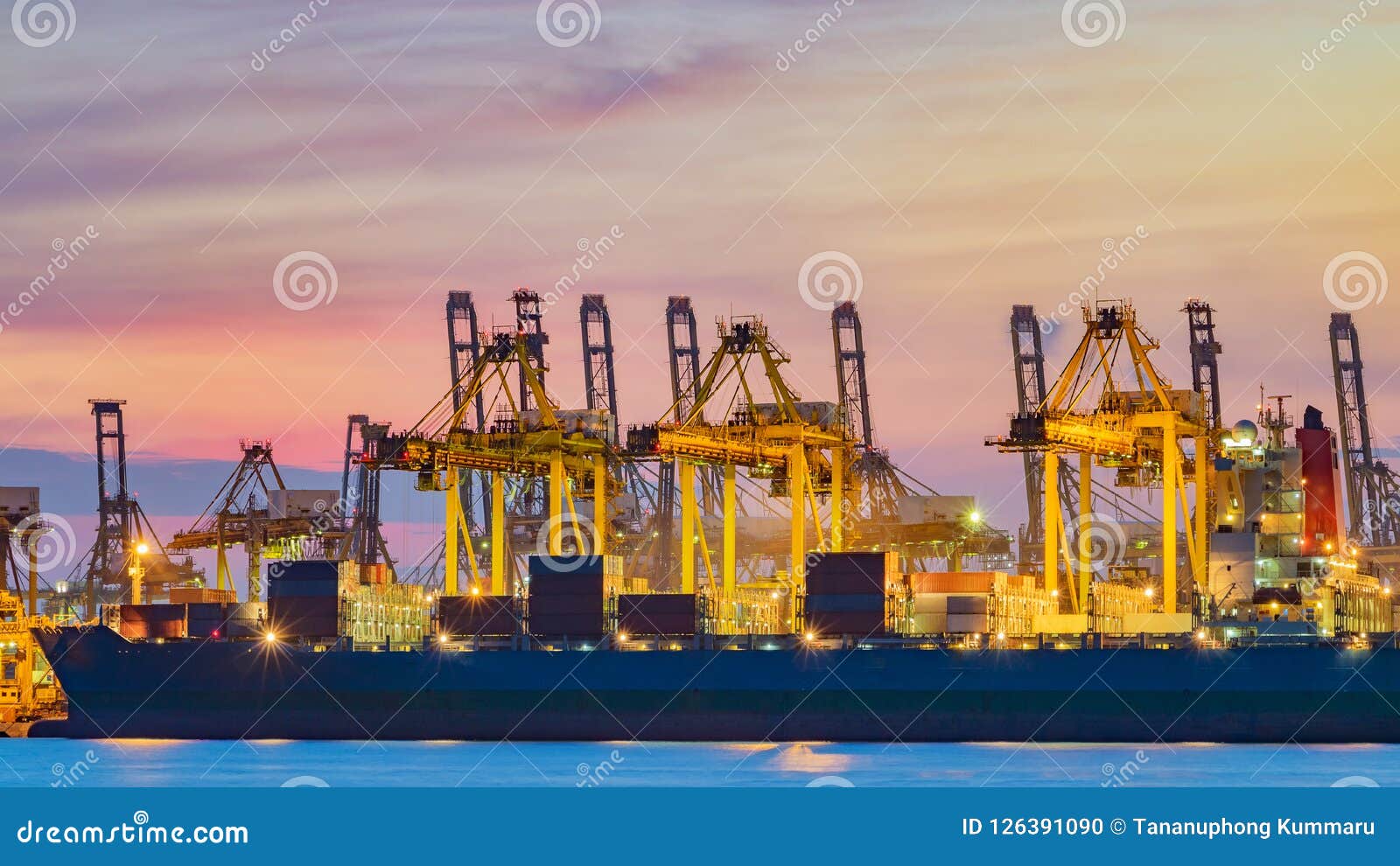 Freighter Ship Loading Cargo at Loading Dock on Twilight Time. Stock ...