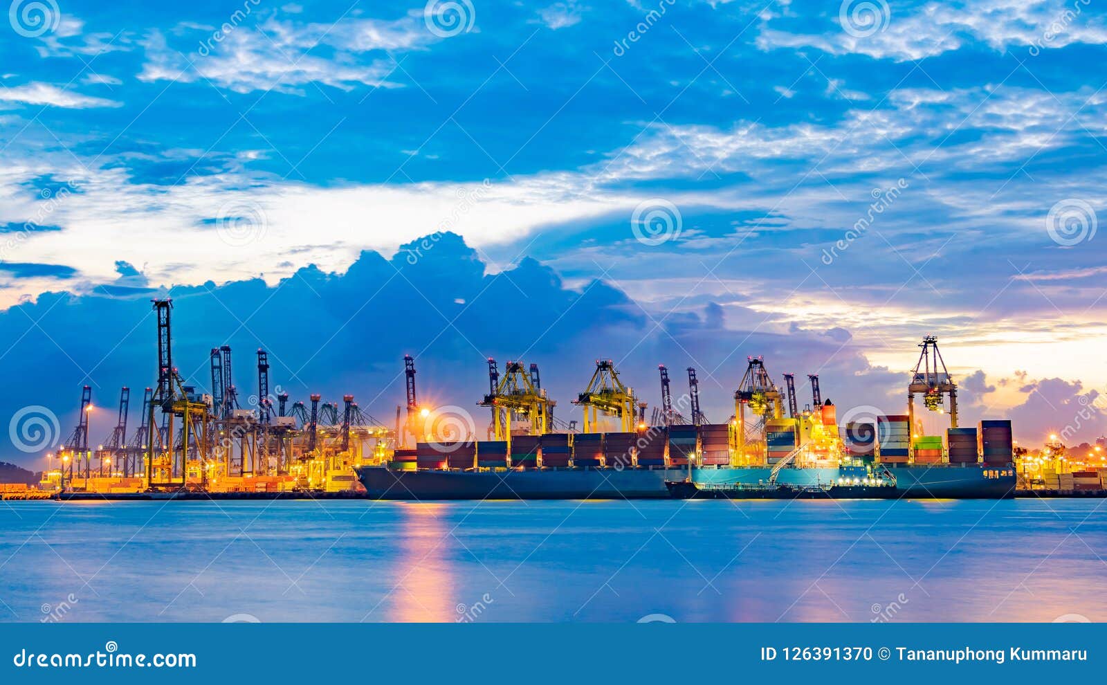 Freighter Ship Loading Cargo at Loading Dock on Twilight Time. Stock ...