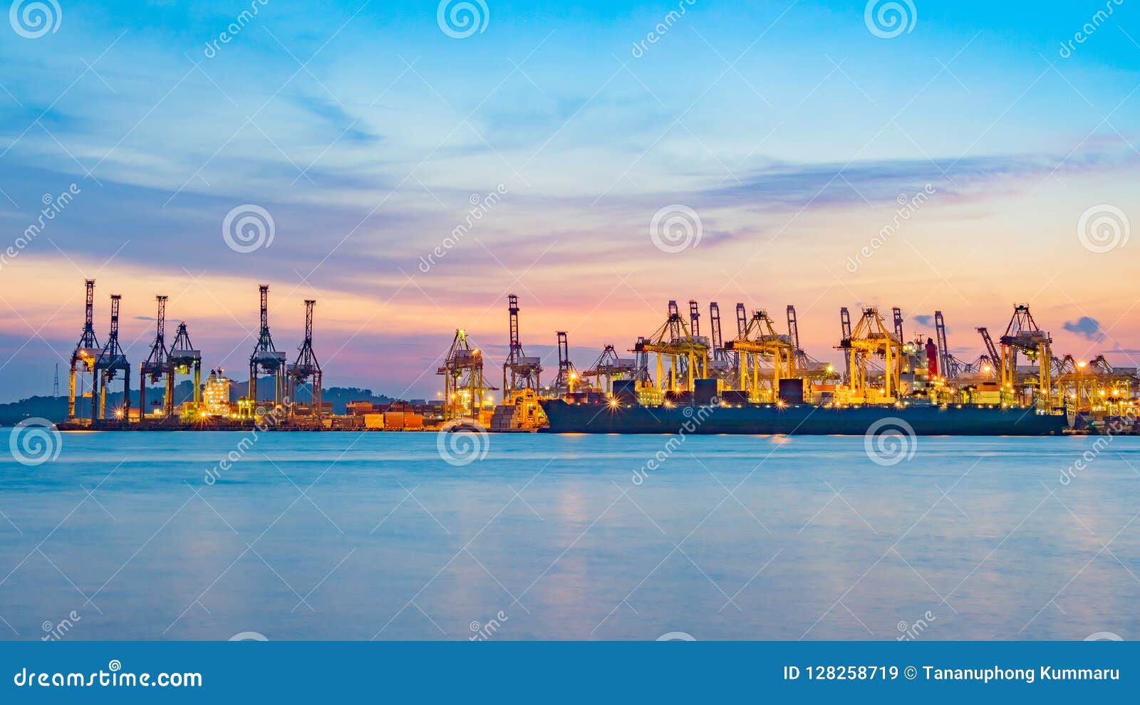 Freighter Ship Loading Cargo at Loading Dock on Twilight Time. Stock ...
