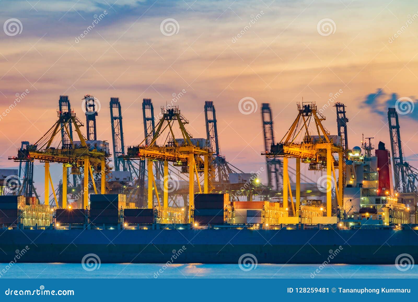 Freighter Ship Loading Cargo at Loading Dock on Twilight Time ...