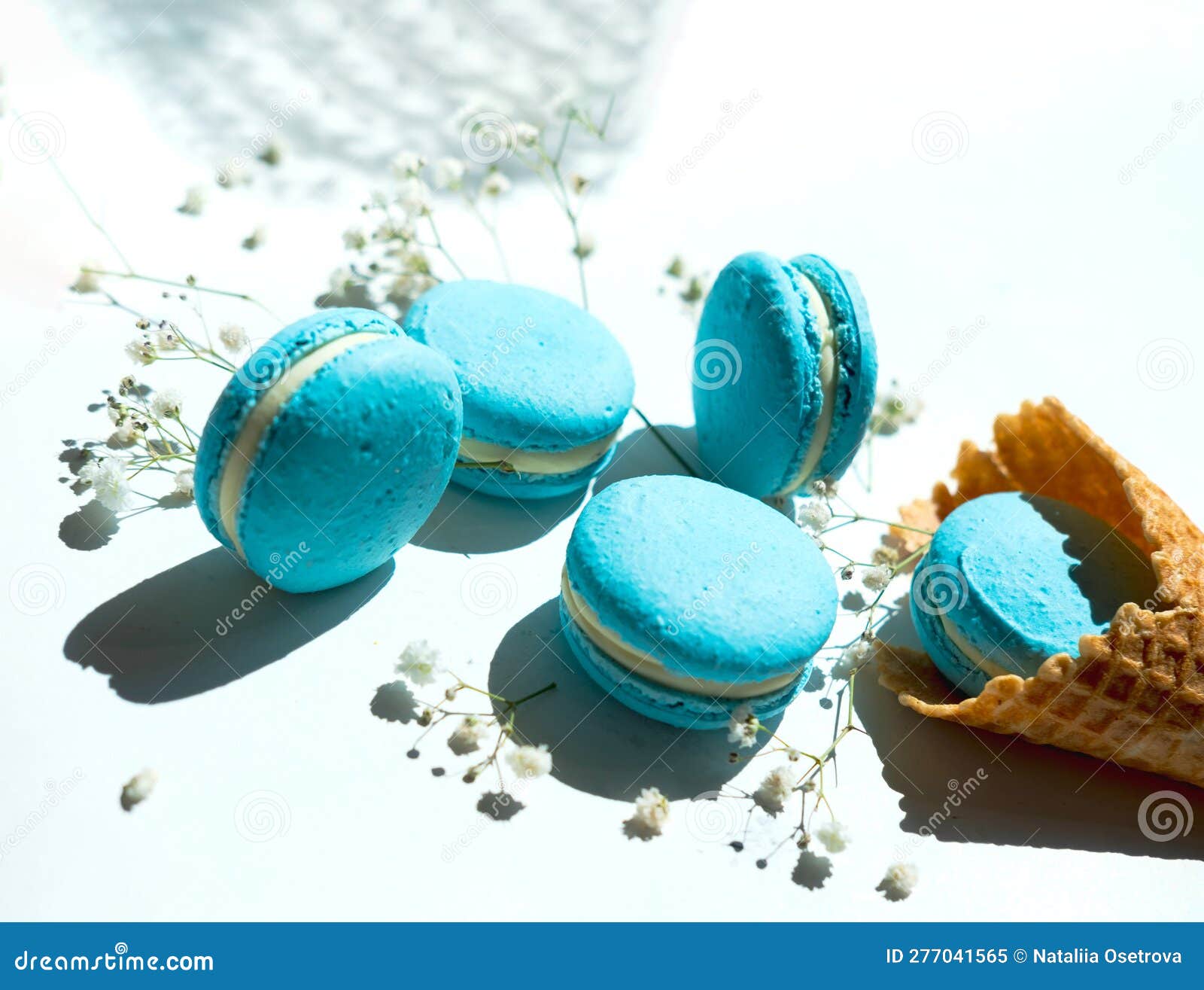 French Blue Macarons on Light Background with Flowers. Close-up Stock ...