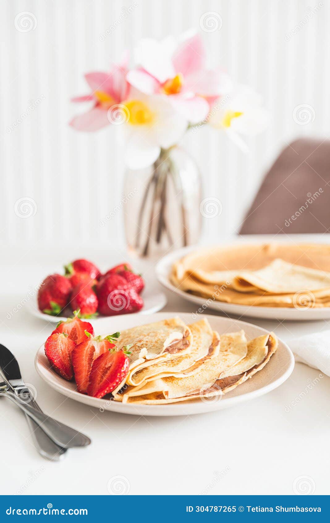 French Crepes with Chocolate Spread and Strawberries on White Table ...