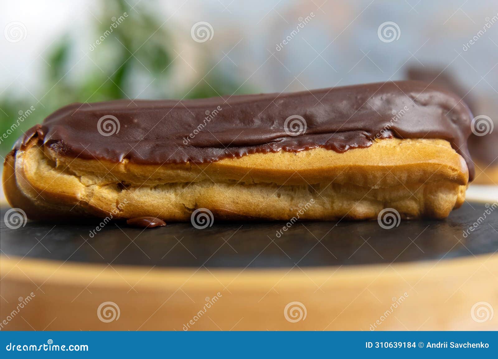 French Ecler with Chocolate. Traditional French Dessert Eclair Stock ...