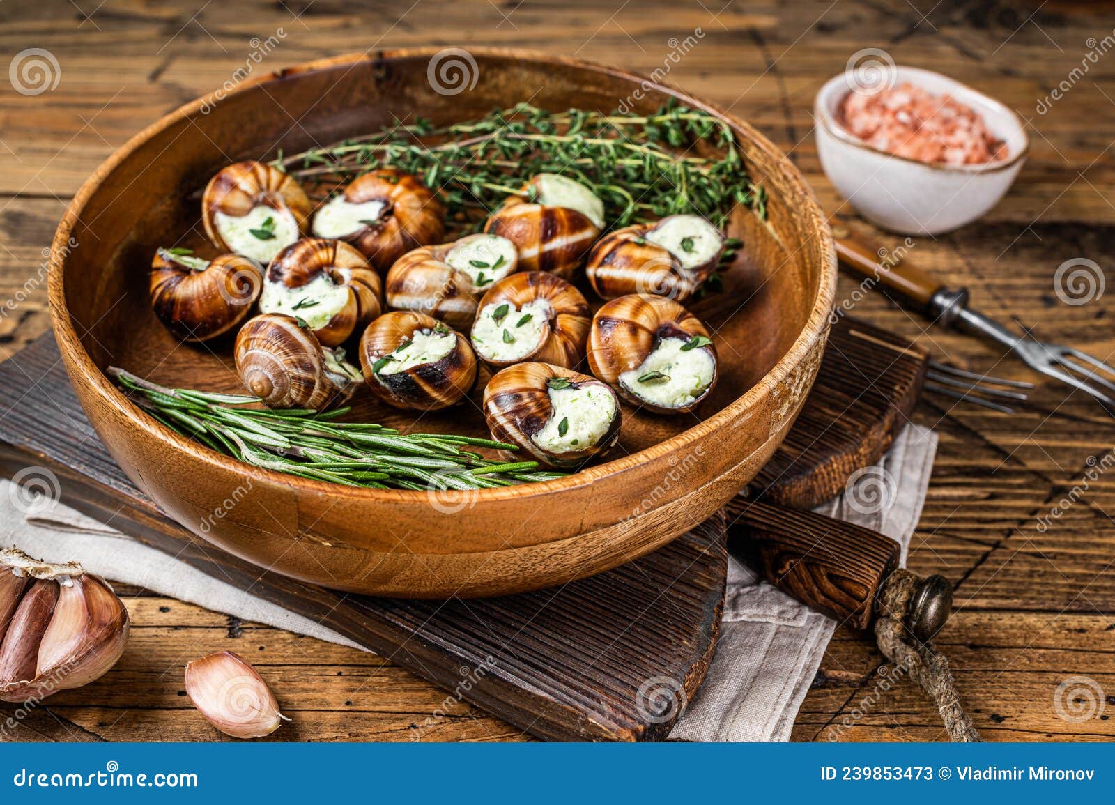 French Escargot Snails with Garlic Butter in a Wooden Plate. Wooden ...