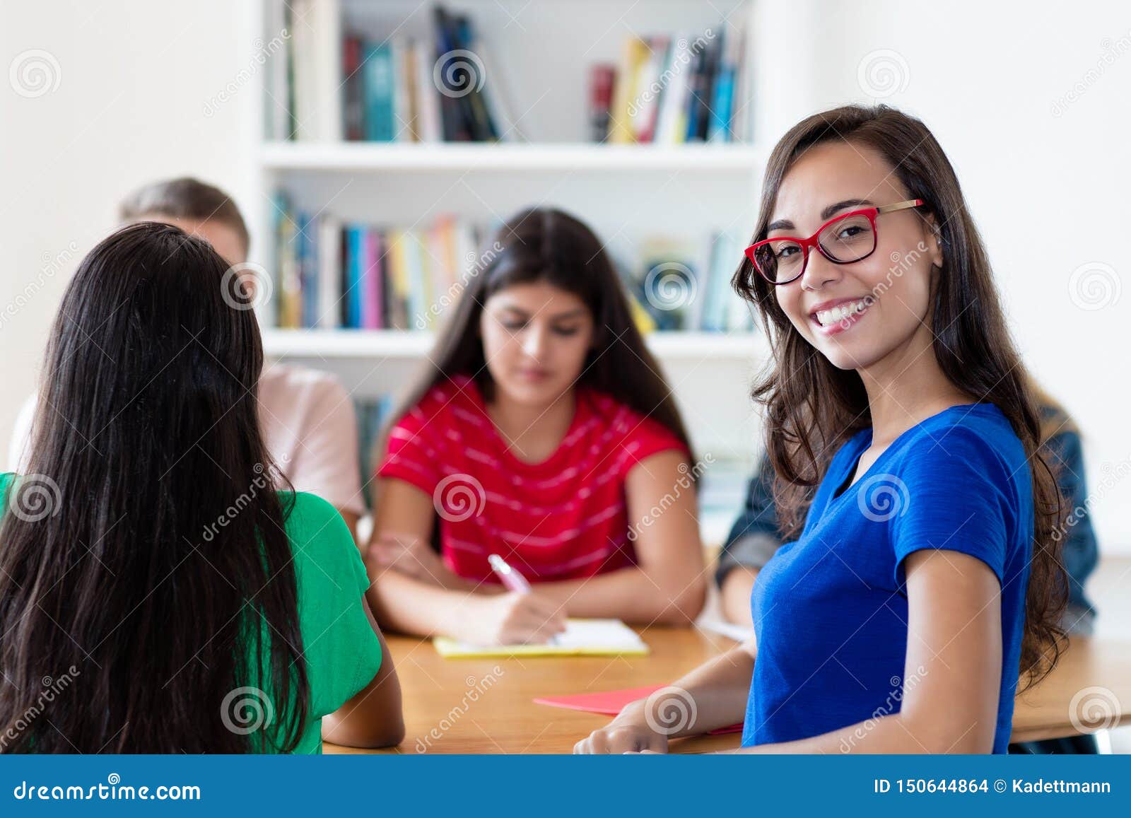 French Female Student Learning with Group of Students Stock Photo ...