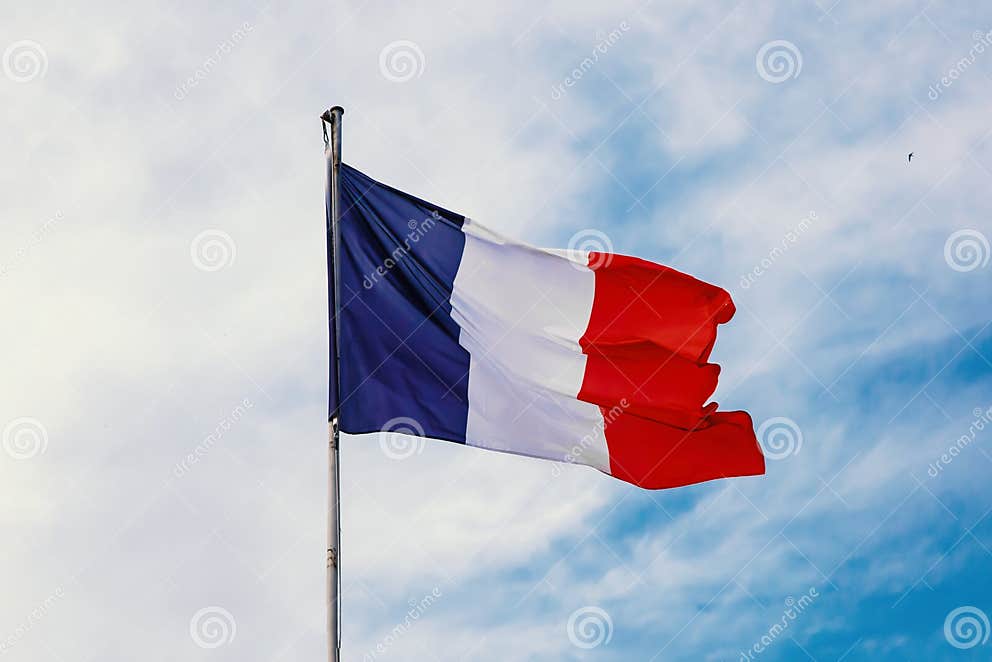 French Flag on Blue Cloudy Aky Background Stock Photo - Image of ...