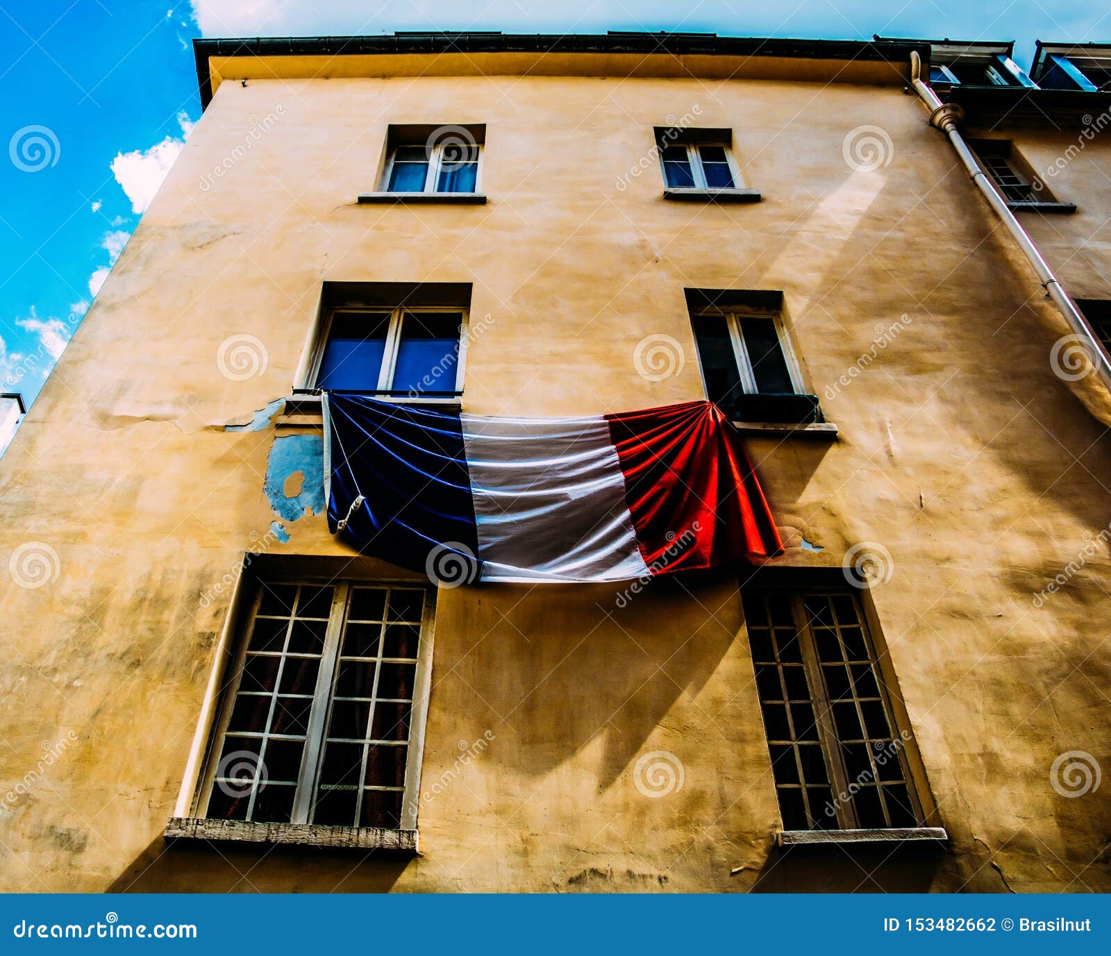 French Flag on Facade of a Building in Paris Stock Photo - Image of ...