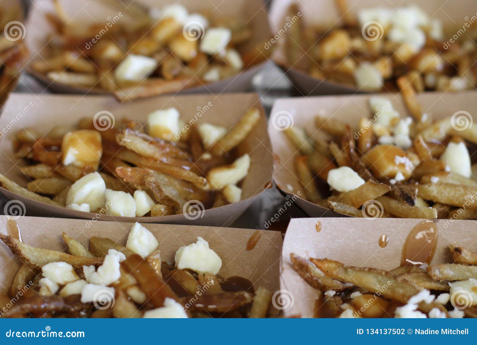 French Fries with Cheese Curds in Small Boxes Stock Photo - Image of ...