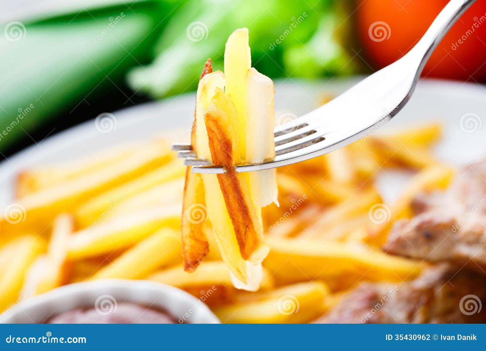 French fries on a fork stock photo. Image of gourmet - 35430962