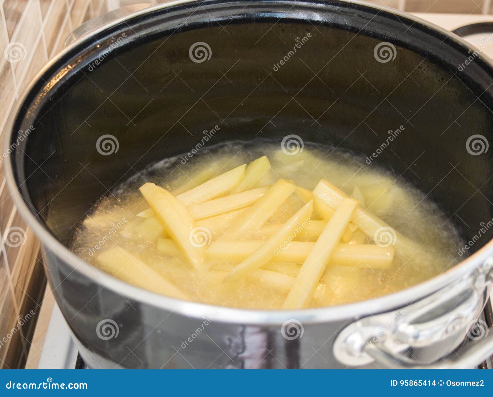 French fries in frying pan stock photo. Image of junk - 95865414