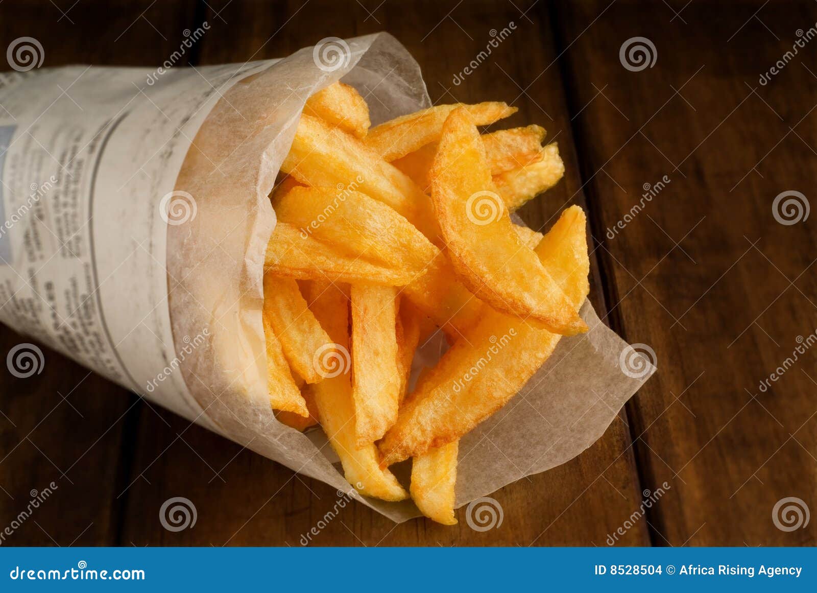 French fries in packet stock photo. Image of newspaper - 8528504