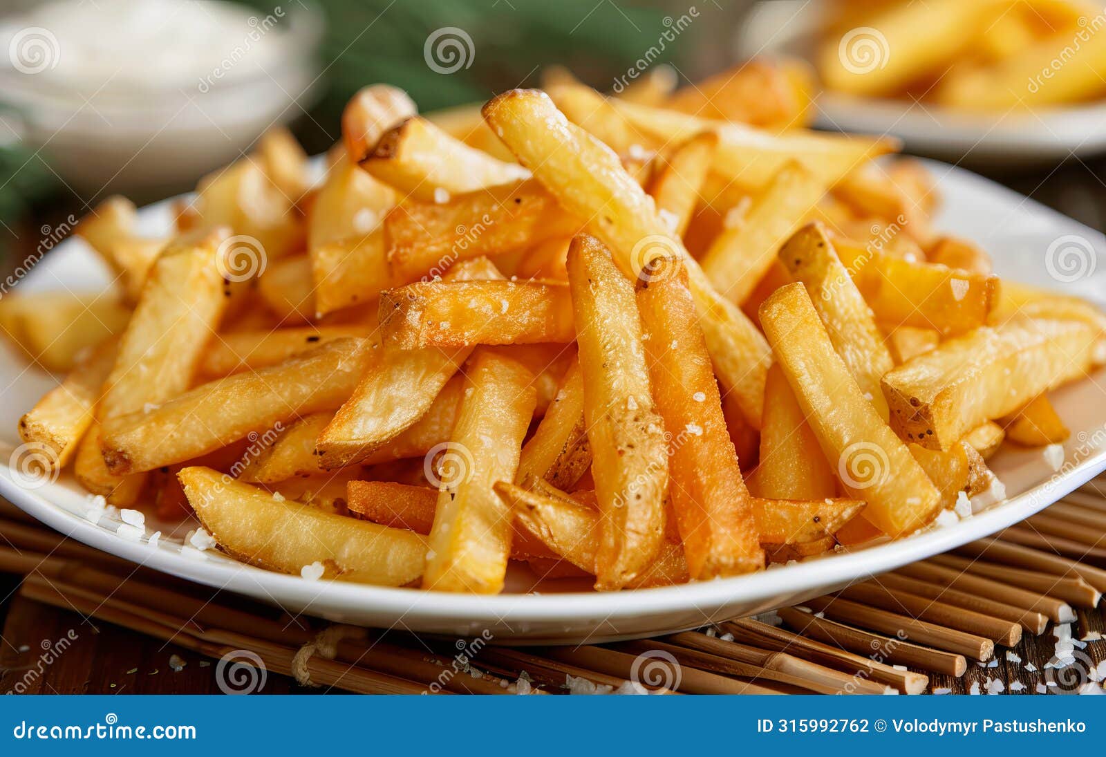 French Fries on a Plate with Salt and Pepper Stock Photo - Image of ...