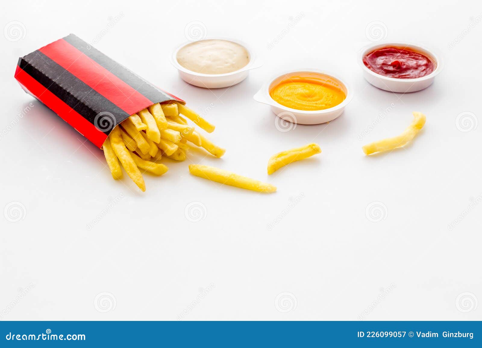 French Fries in Red Paper Wrapper with Different Sauces Stock Image ...