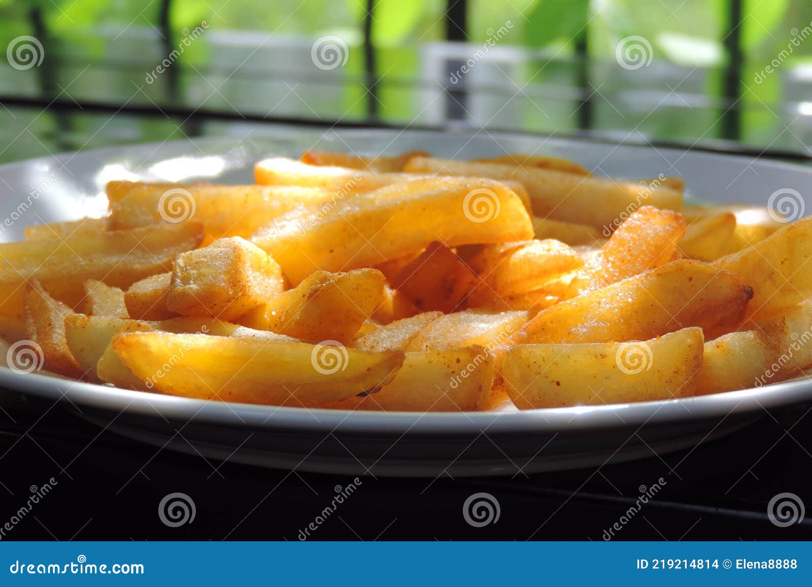 French Fries, Slices in a Plate and Sun Glare Stock Photo - Image of ...
