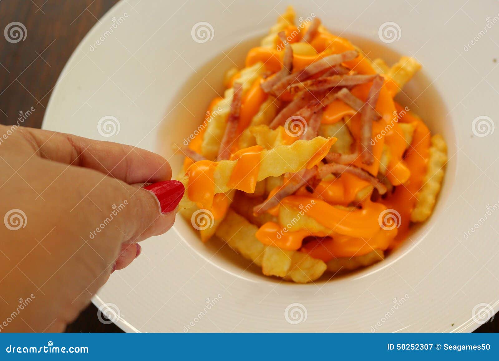 French Fries Topped with Cheese on Plate. Stock Image - Image of ...