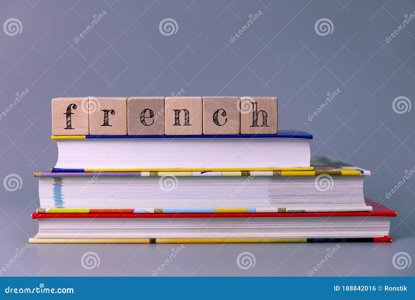 French Language Course and Learning Concept. Stack of Books with Wooden ...
