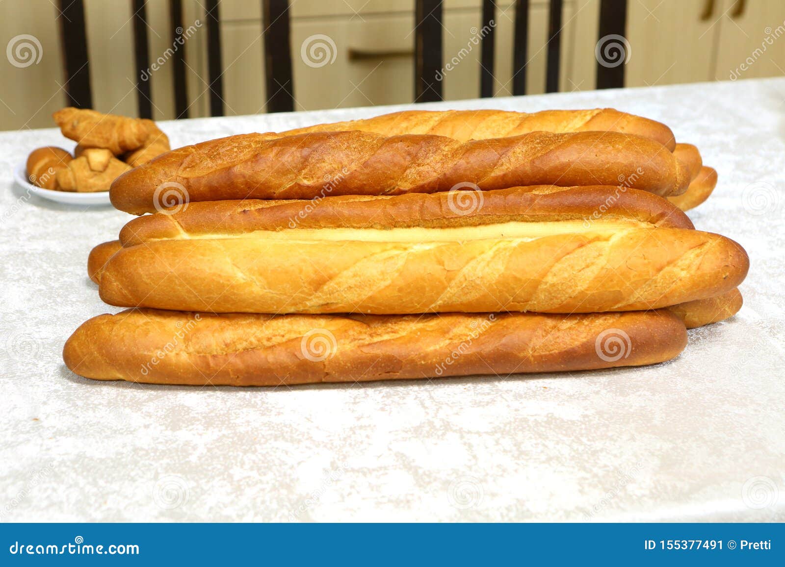French Loaves on the Kitchen Table. French Bread Stock Image - Image of ...