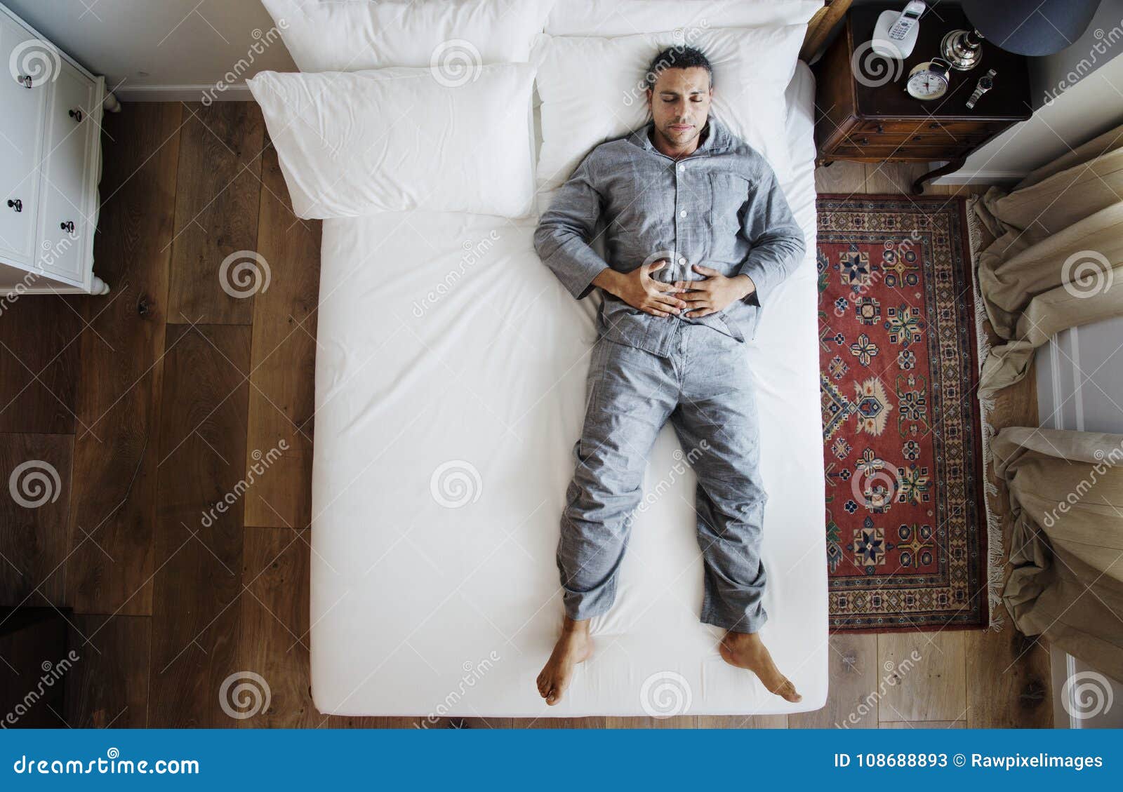 French Man Sleep Alone on Bed Stock Image - Image of latin, clock ...
