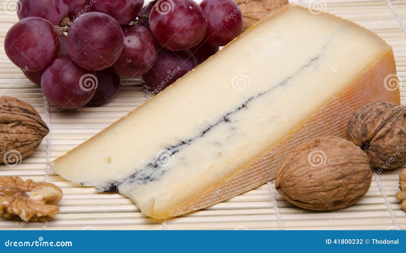 French Morbier Cheese on a Straw Placemat Stock Photo - Image of walnut ...