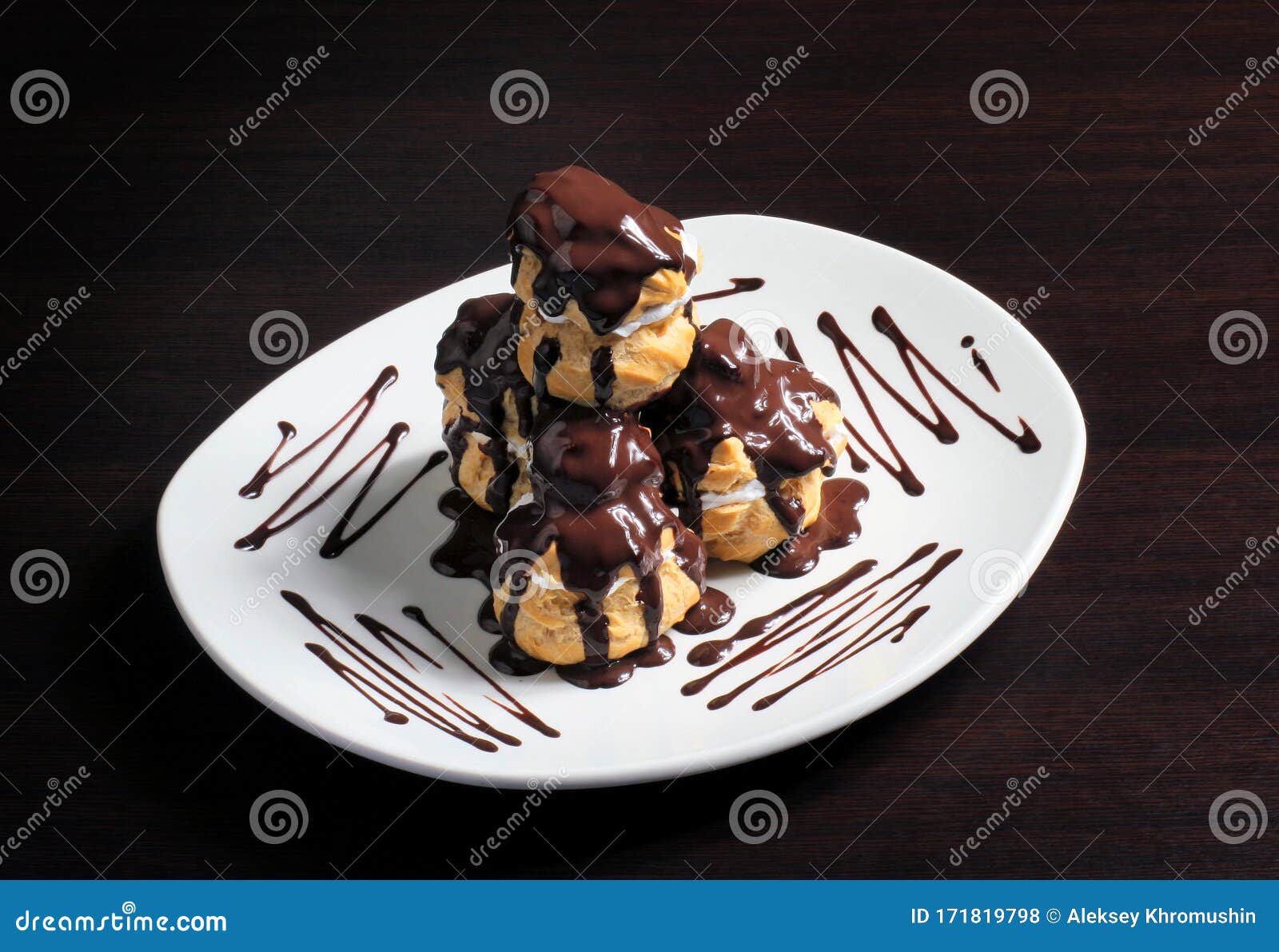 French Profiterole with Chocolate Icing on a Plate Stock Photo - Image ...