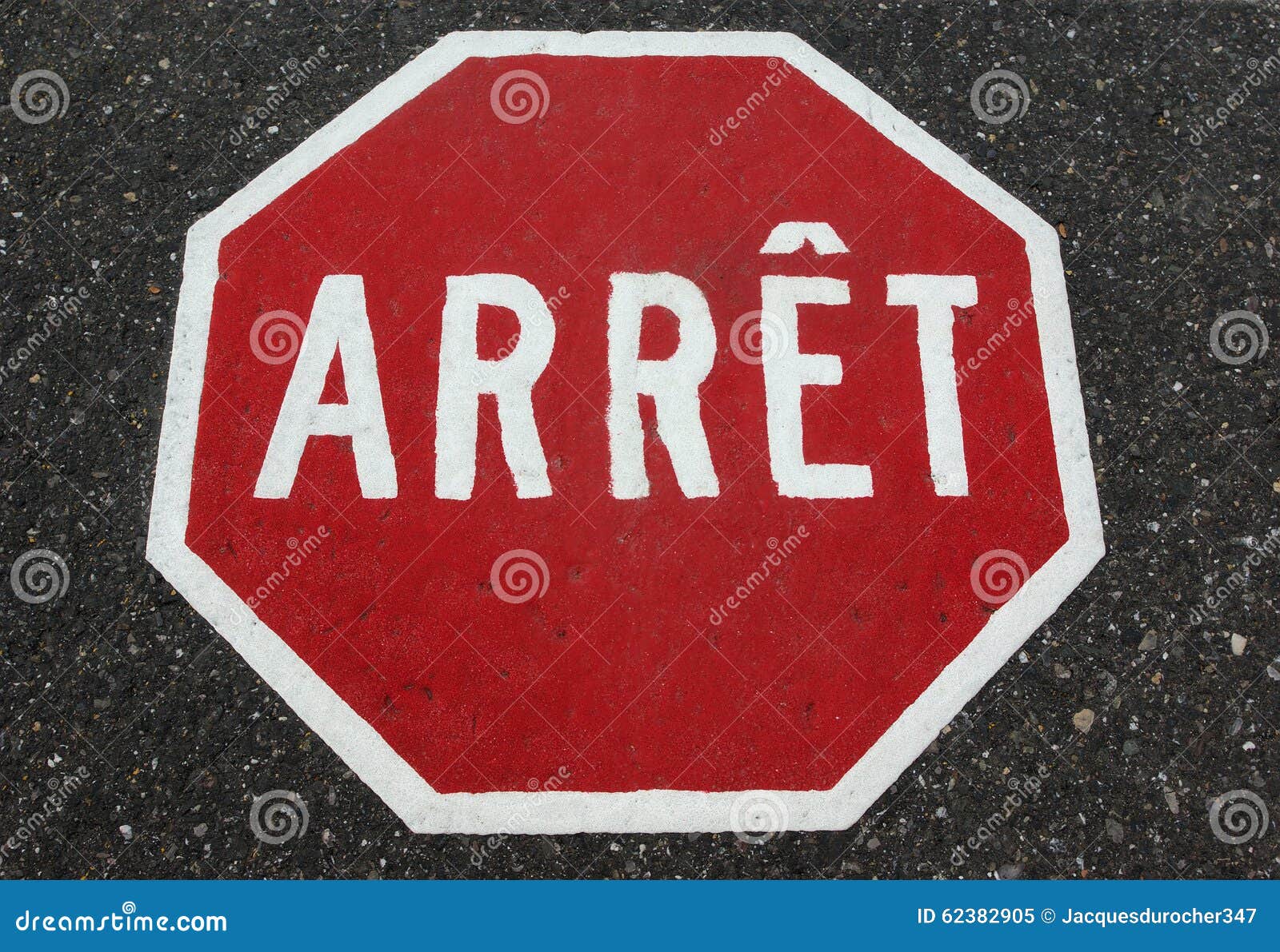 French Quebec Stop Sign Painted on Asphalt Stock Image - Image of arret ...