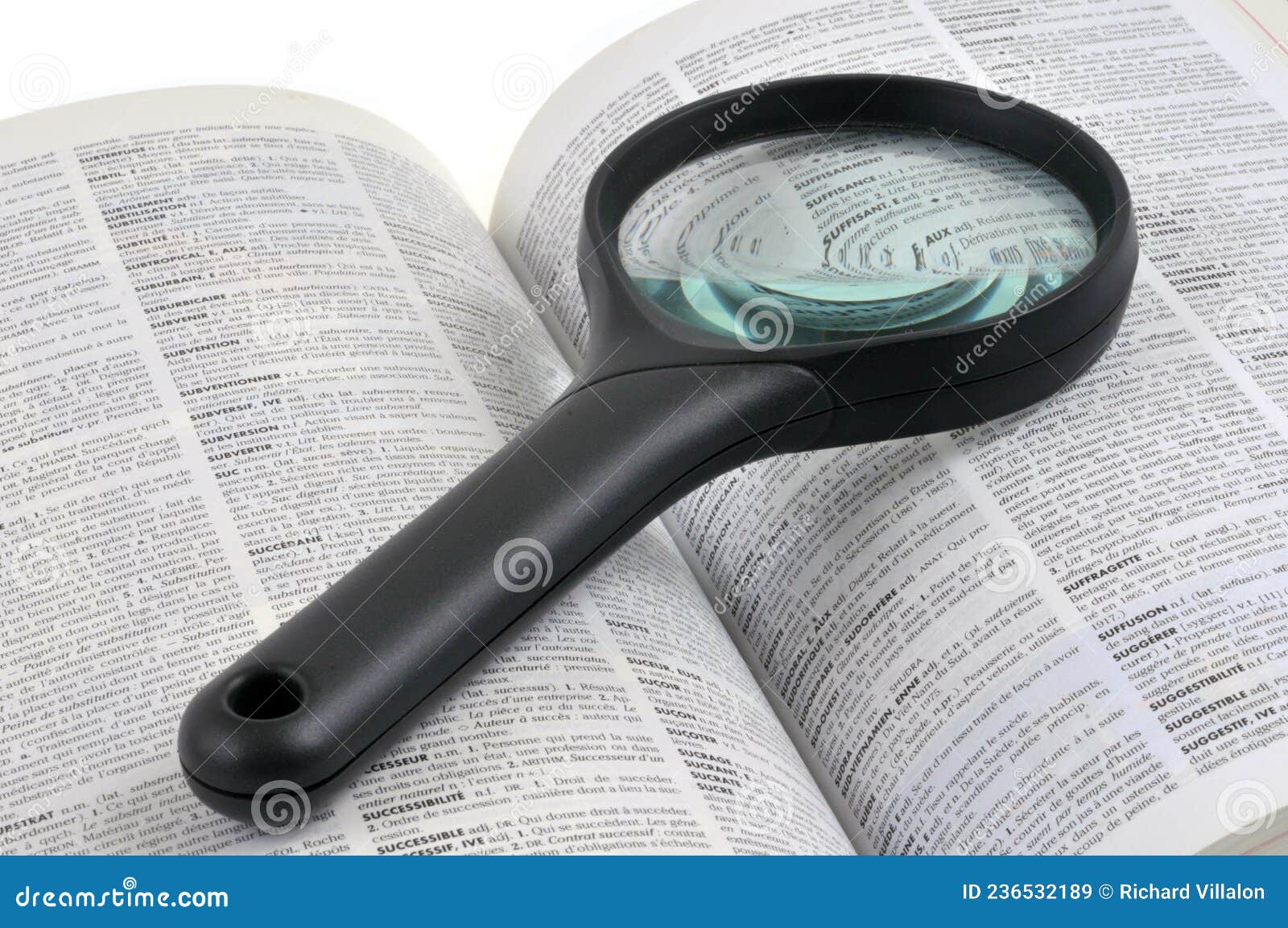 Open French Dictionary with a Magnifying Glass Close-up Editorial Stock ...