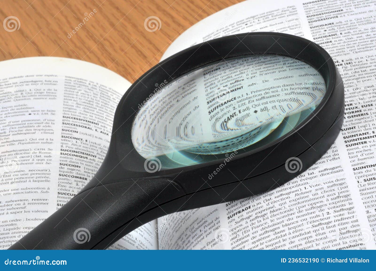 Open French Dictionary with a Magnifying Glass Close-up Editorial Image ...