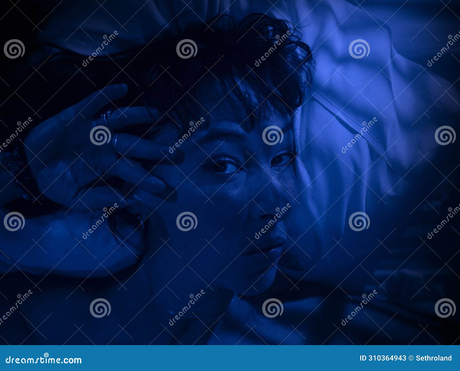 A French Woman Lying on a Bed Under Blue Light, Moonlight Shining ...