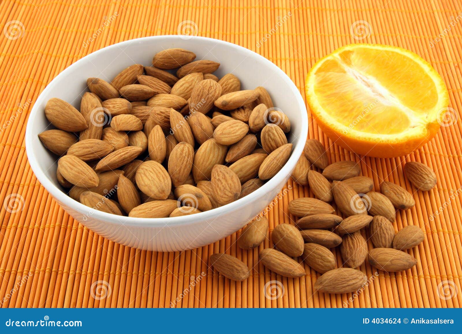 Fresh almonds and orange stock photo. Image of nutrition - 4034624