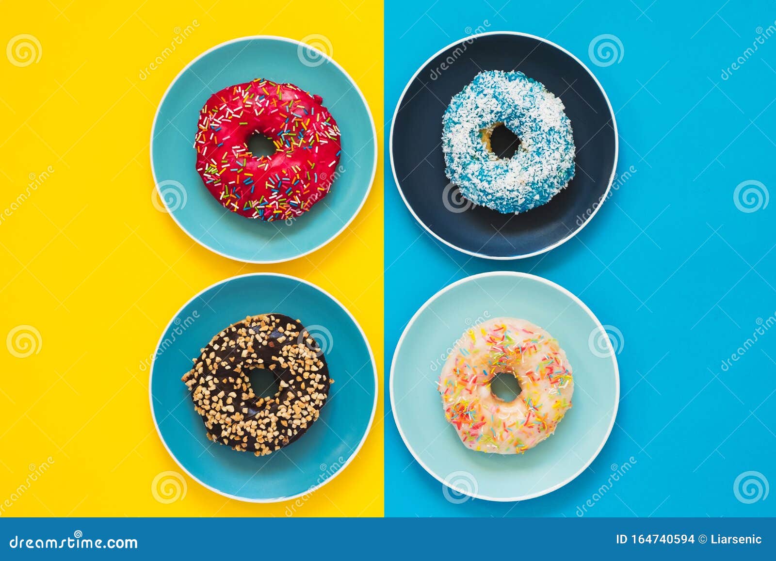 Fresh Appetizing 4 Donuts Lying on Plate in Colored Yellow and Blue ...