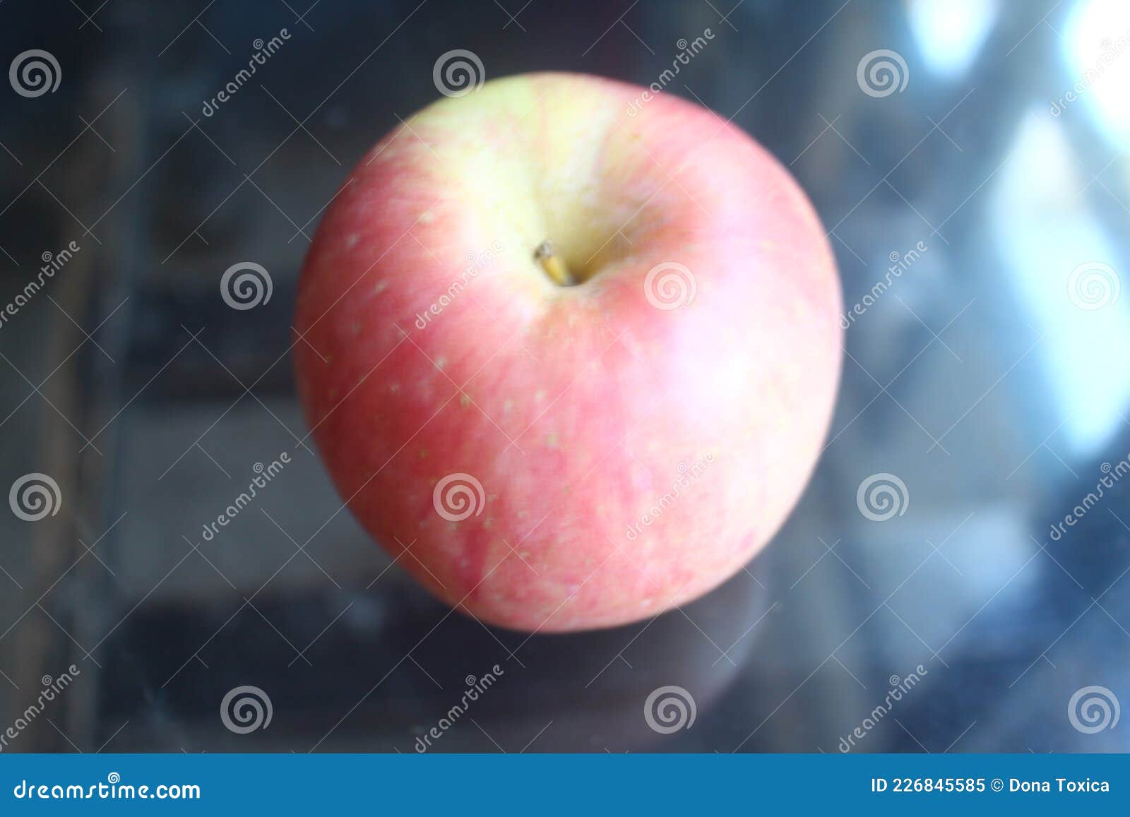 A Fresh Apple on a Mirror Table Stock Image - Image of green, grow ...