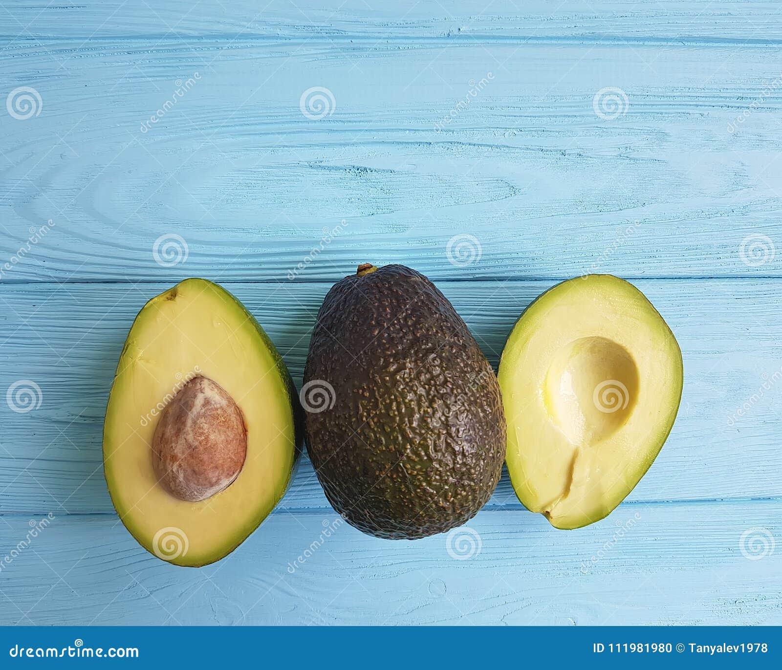 Fresh Avocado Heap on Blue Wooden Stock Photo - Image of space, organic ...