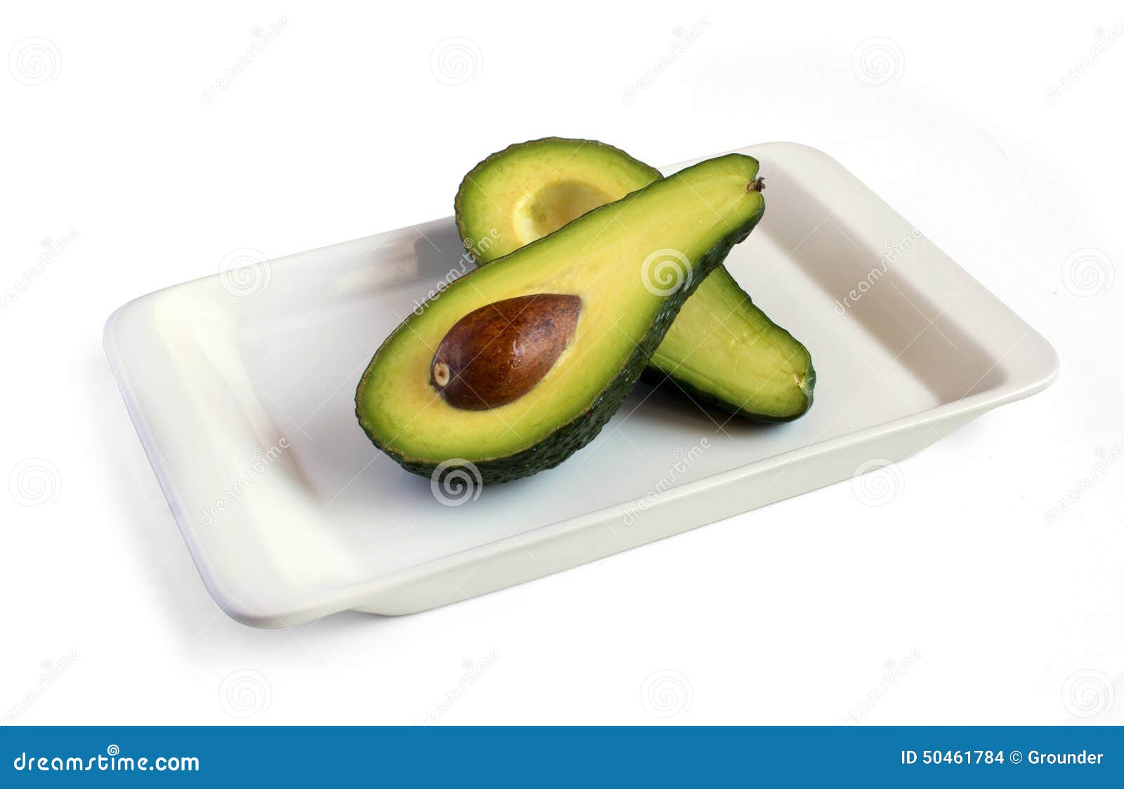 Fresh Avocado Cut in Half on Square Plate Stock Photo - Image of ...