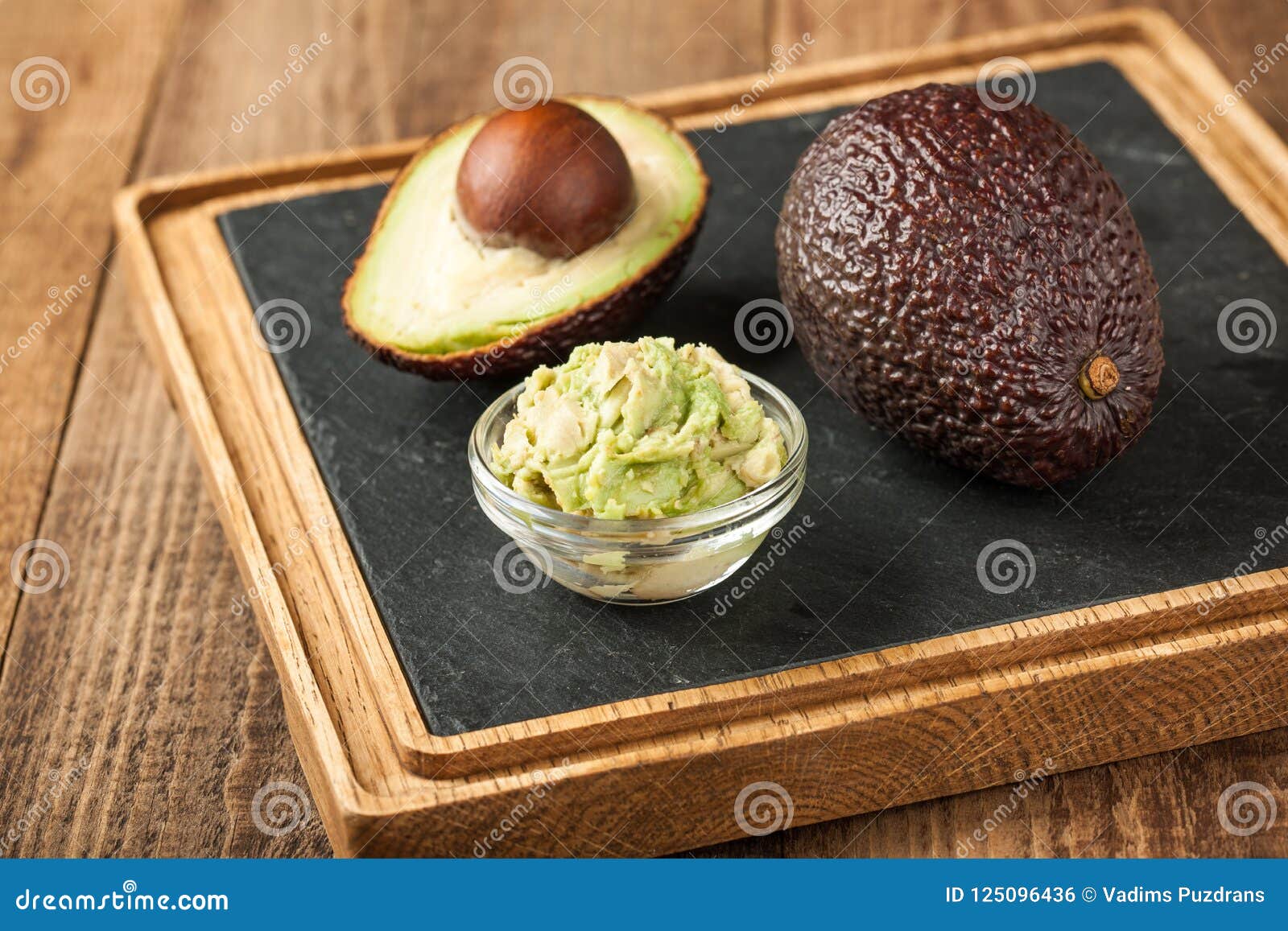 Fresh Avocado on Wooden Table Stock Photo - Image of avocado, cream ...