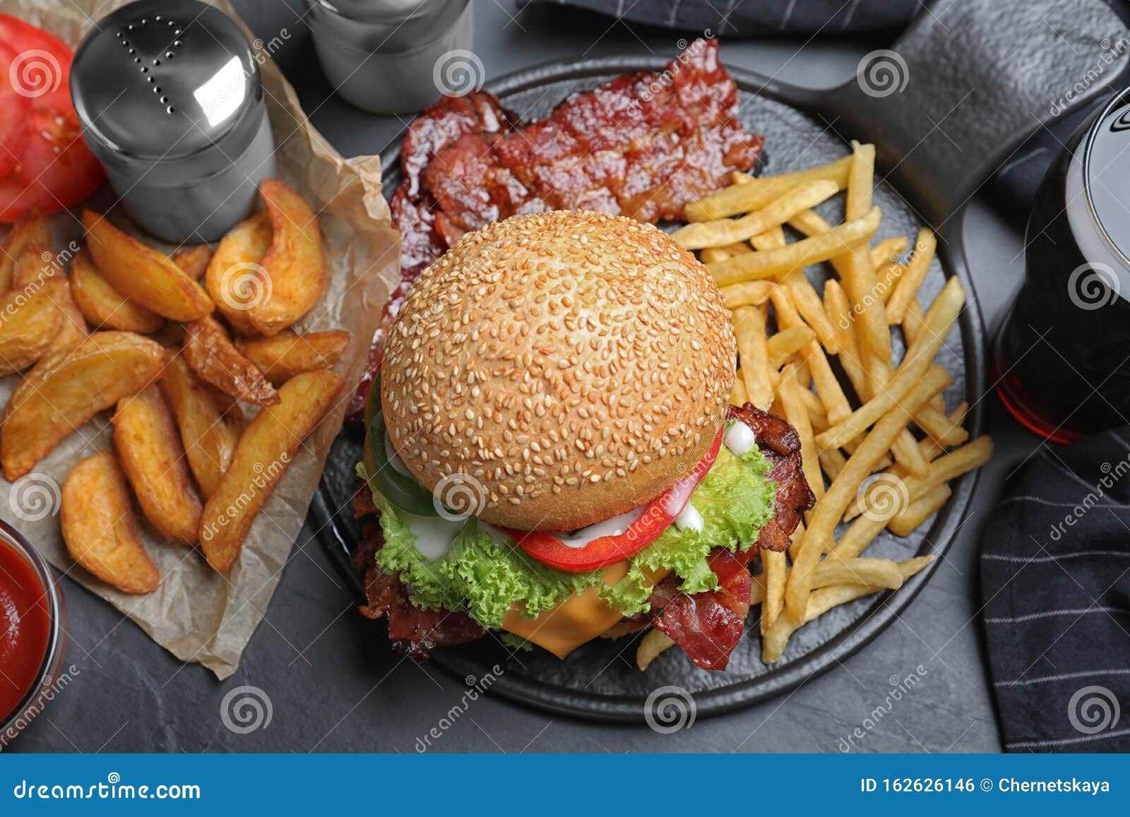 Fresh Bacon Burger and Fries on Table, Above View Stock Photo - Image ...