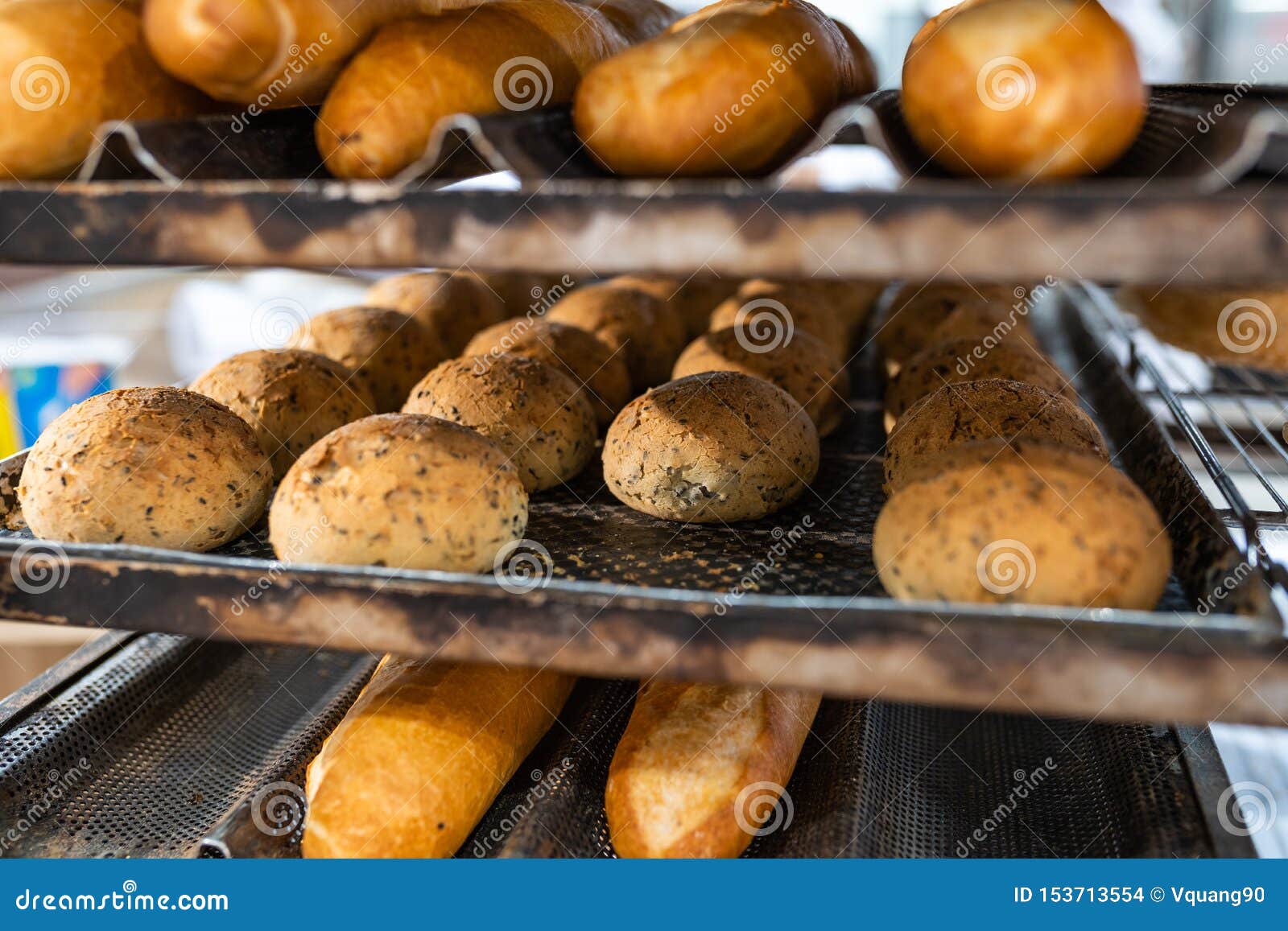 Fresh Baked Coffee Buns and Baguette Breads on Cooling Rack Stock Photo ...