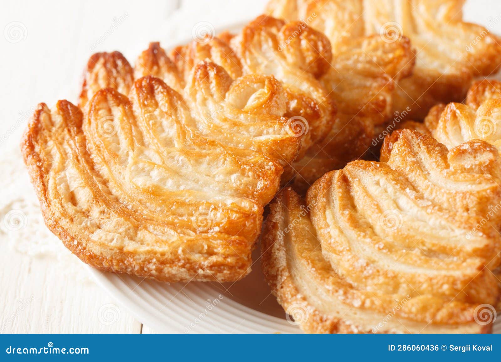 Fresh Baked Palmier Puff Pastry Closeup on the Plate. Horizontal Stock ...