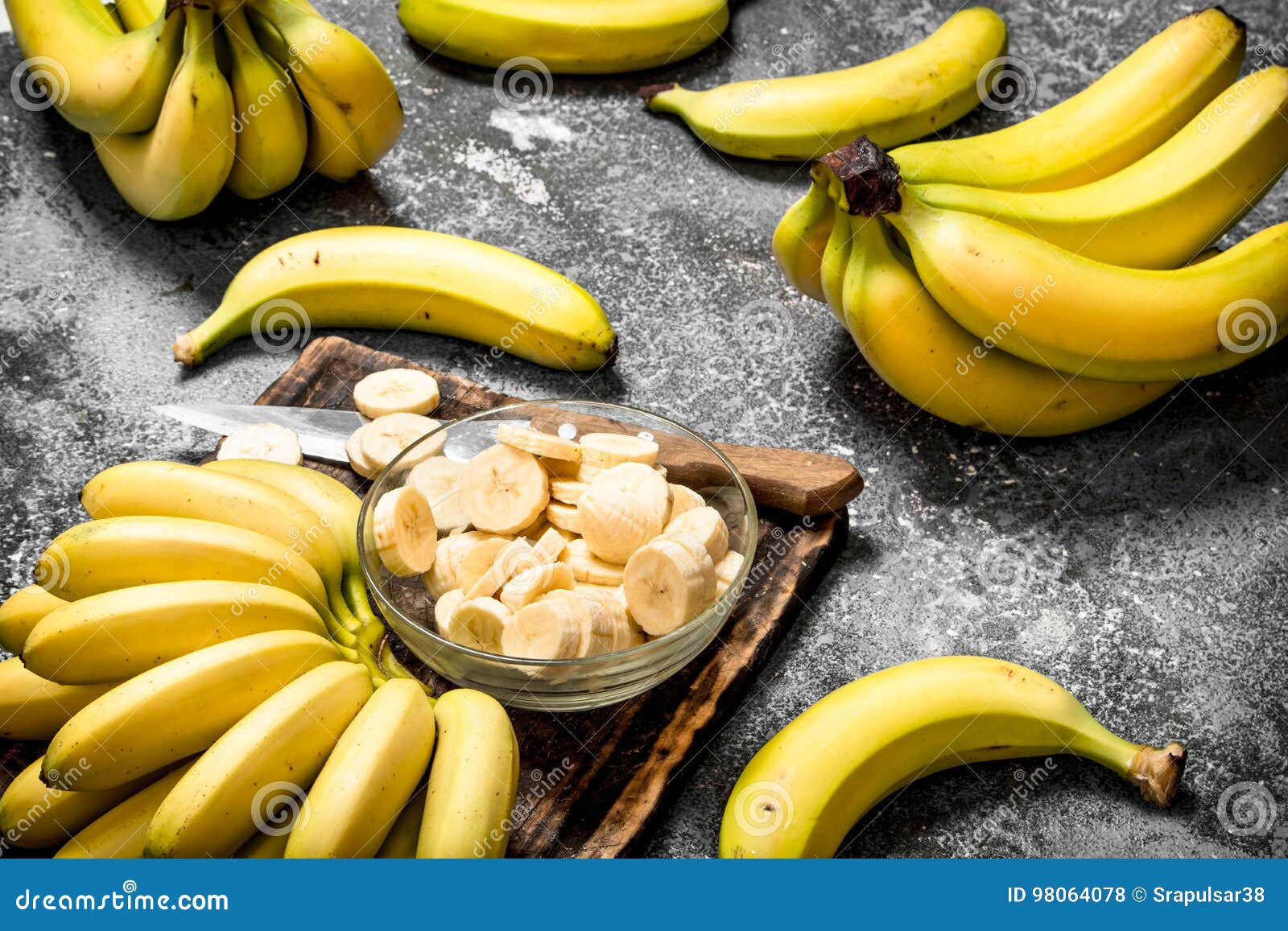 Fresh Bananas with Pieces of Sliced Bananas in a Bowl. Stock Photo ...