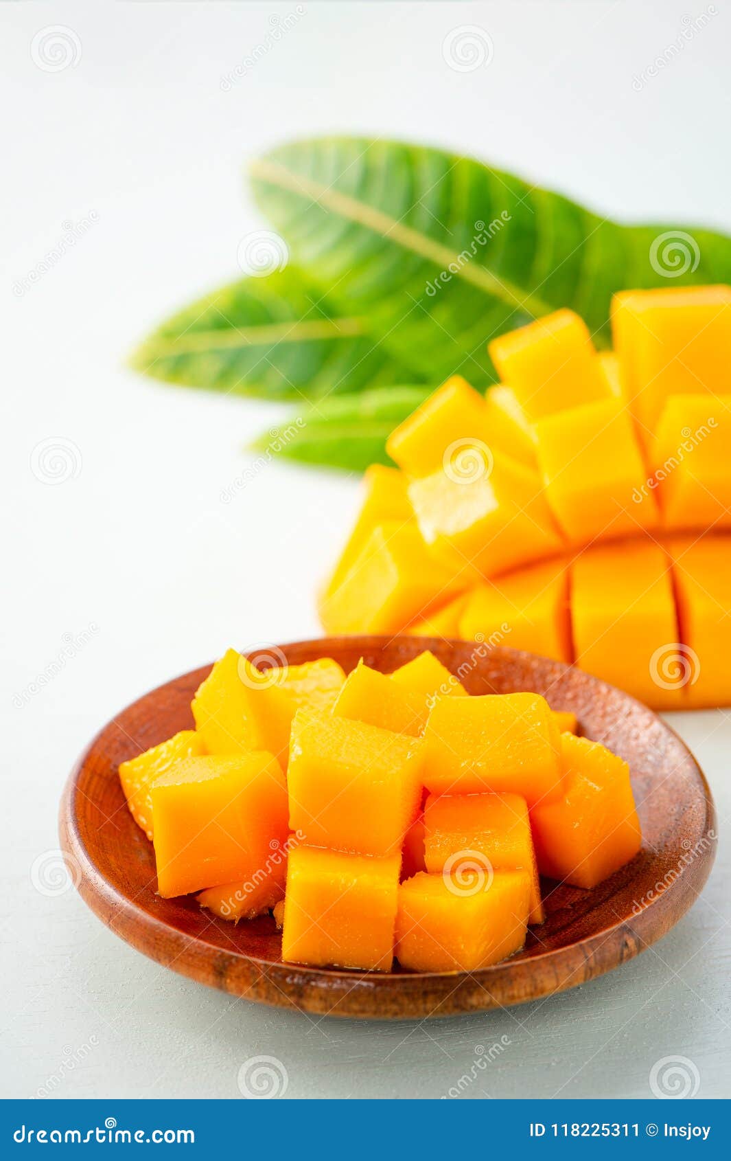 Fresh and Beautiful Mango Fruit with Sliced Diced Mango Chunks on a ... Fresh and Beautiful Mango Fruit with Sliced Diced Mango Chunks on a ...