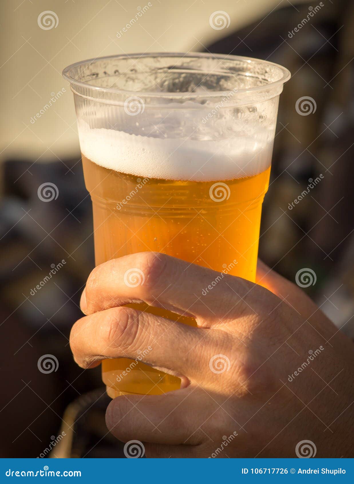 Fresh Beer in a Plastic Cup in the Hand Stock Photo - Image of lager ...