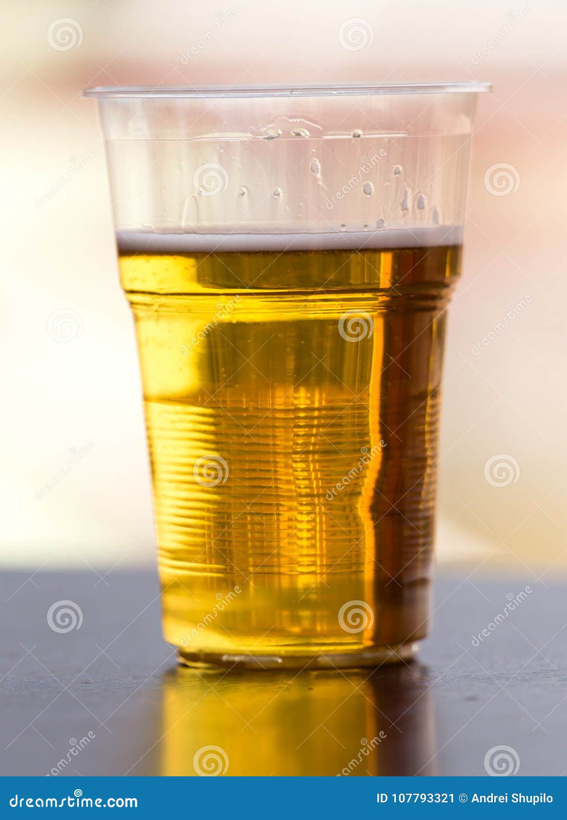 Fresh Beer in a Plastic Glass on the Table Stock Image - Image of ...