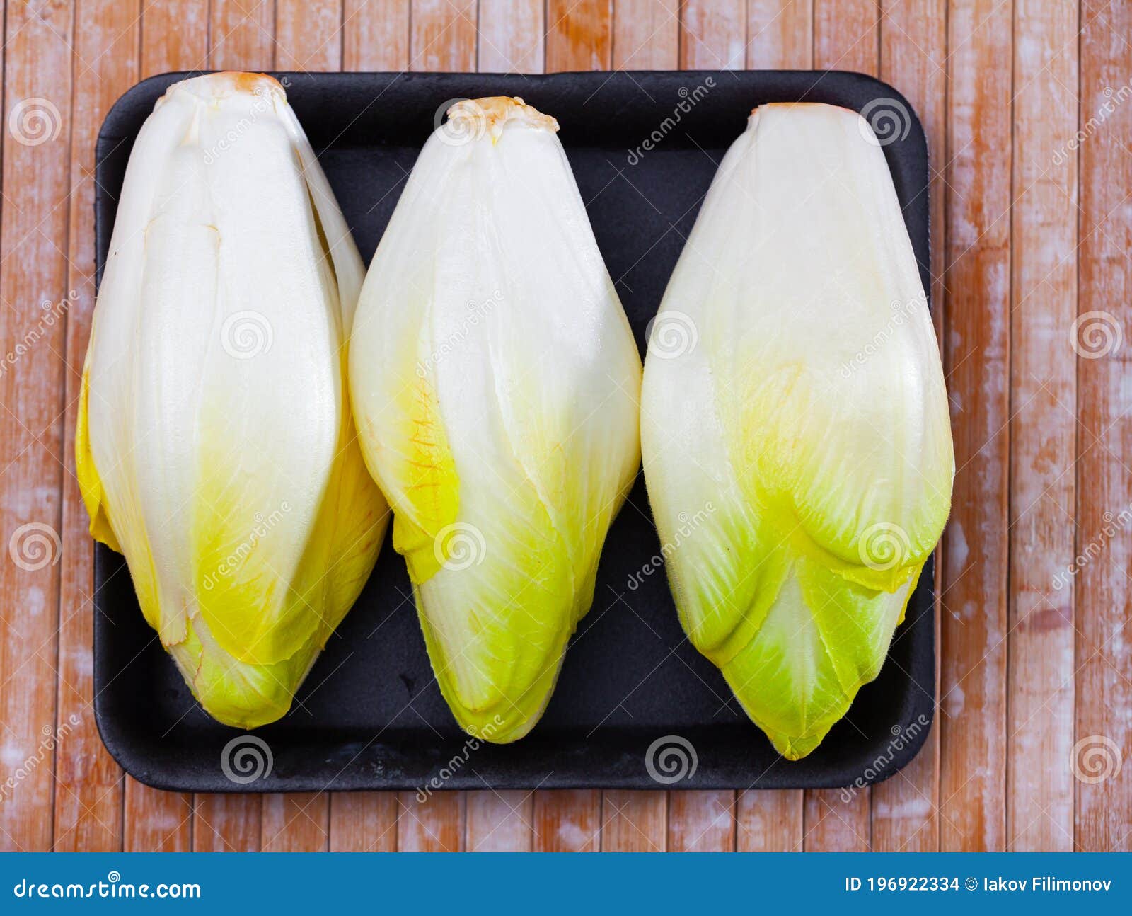 Fresh Belgian Endive Head on Wooden Surface Stock Photo - Image of ...