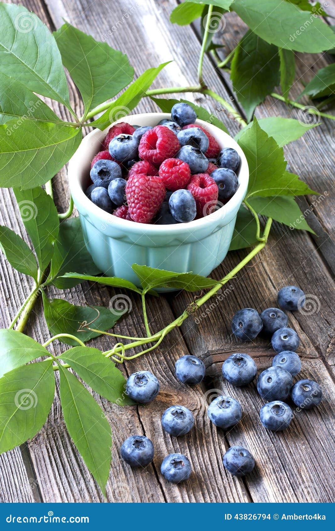 Fresh Berries in a Bowl on a Wooden Table Stock Photo - Image of ...