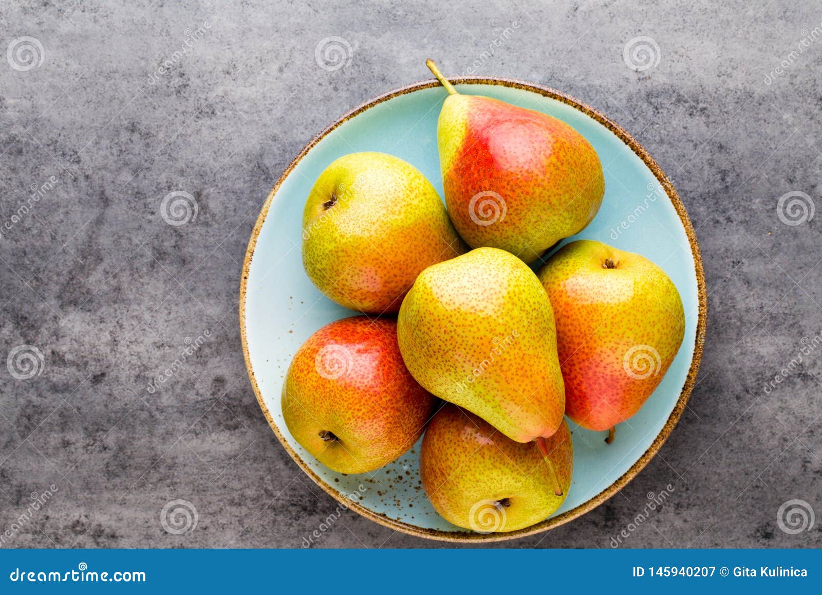 Fresh Bio Pear with Leaves on the Plate. Gray Stone Table Stock Image ...