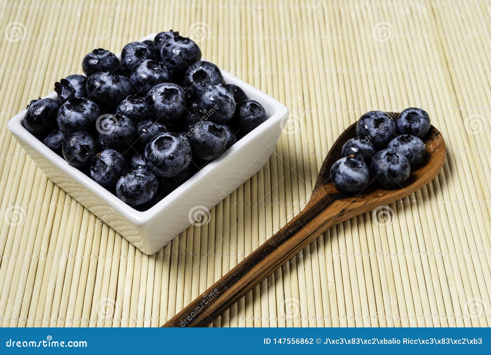 Fresh Blueberries Inside Pot of White Ceramic on Bamboo Background ...