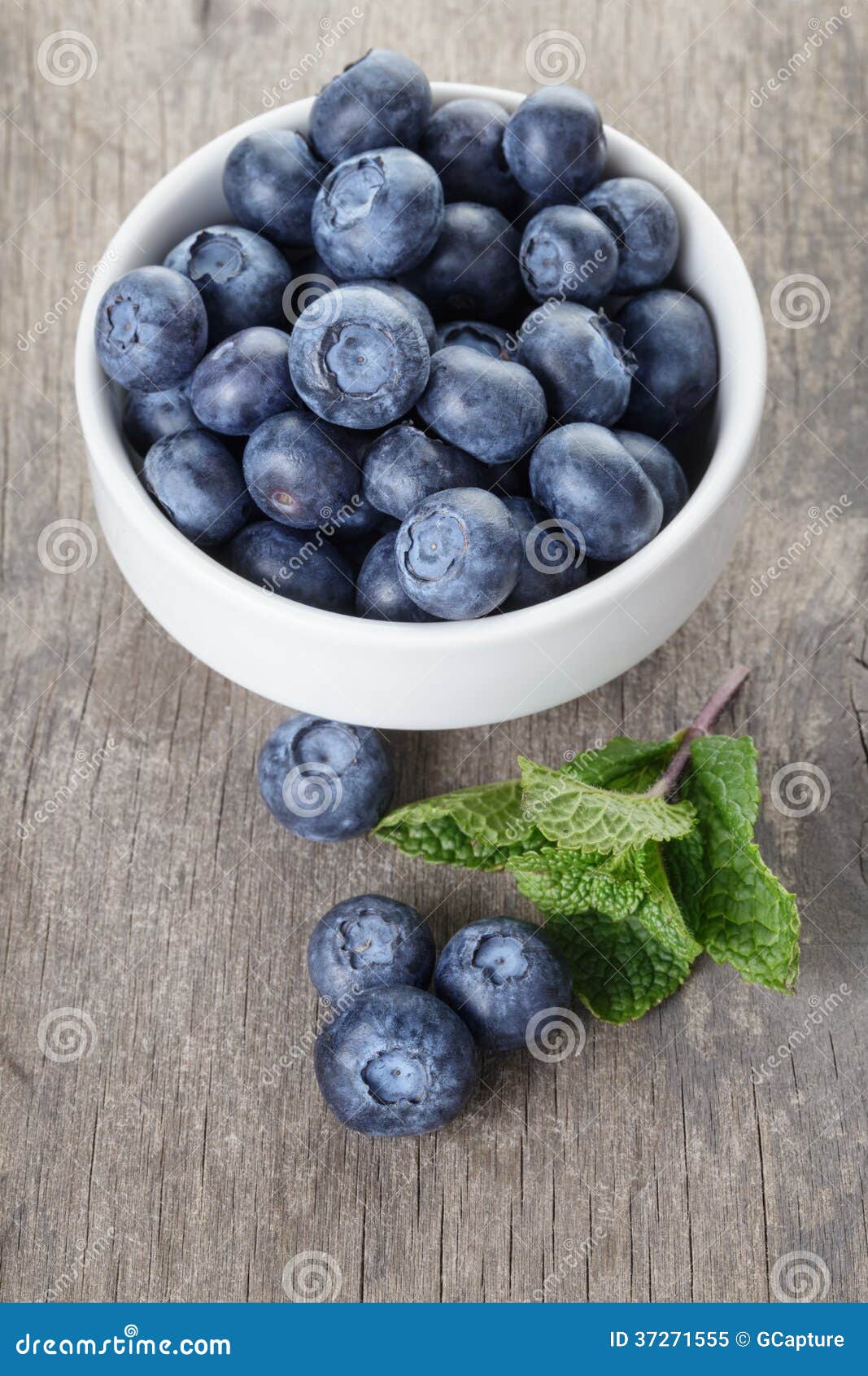 Fresh Blueberries in White Bowl on Wood Table Stock Image - Image of ...