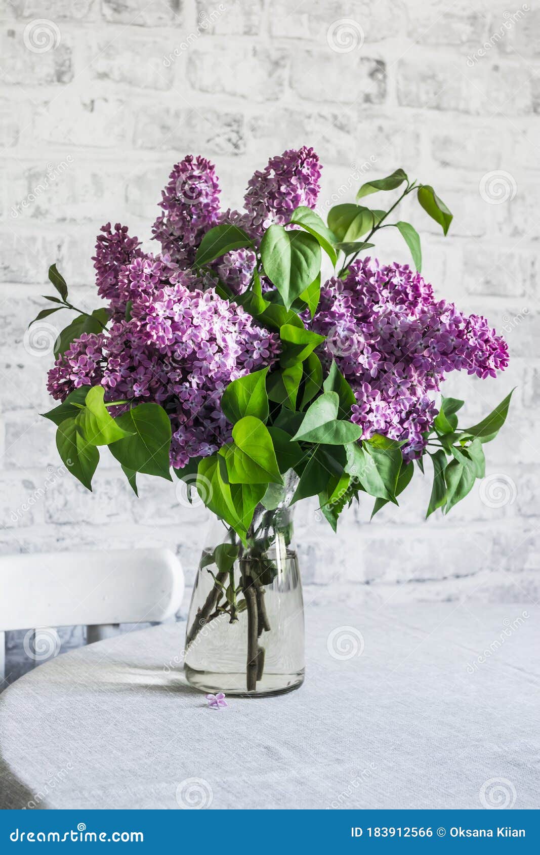 Fresh Bouquet of Lilacs on the Table in a Bright Room. Home Interior ...