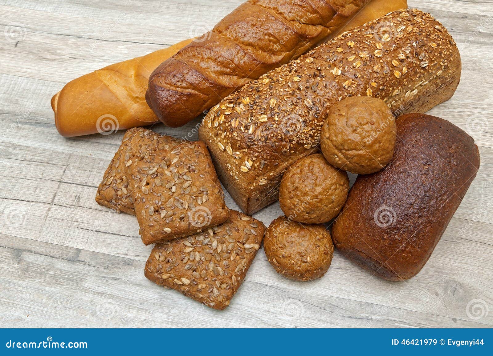 Fresh Bread of Different Varieties on Wooden Background Stock Image ...