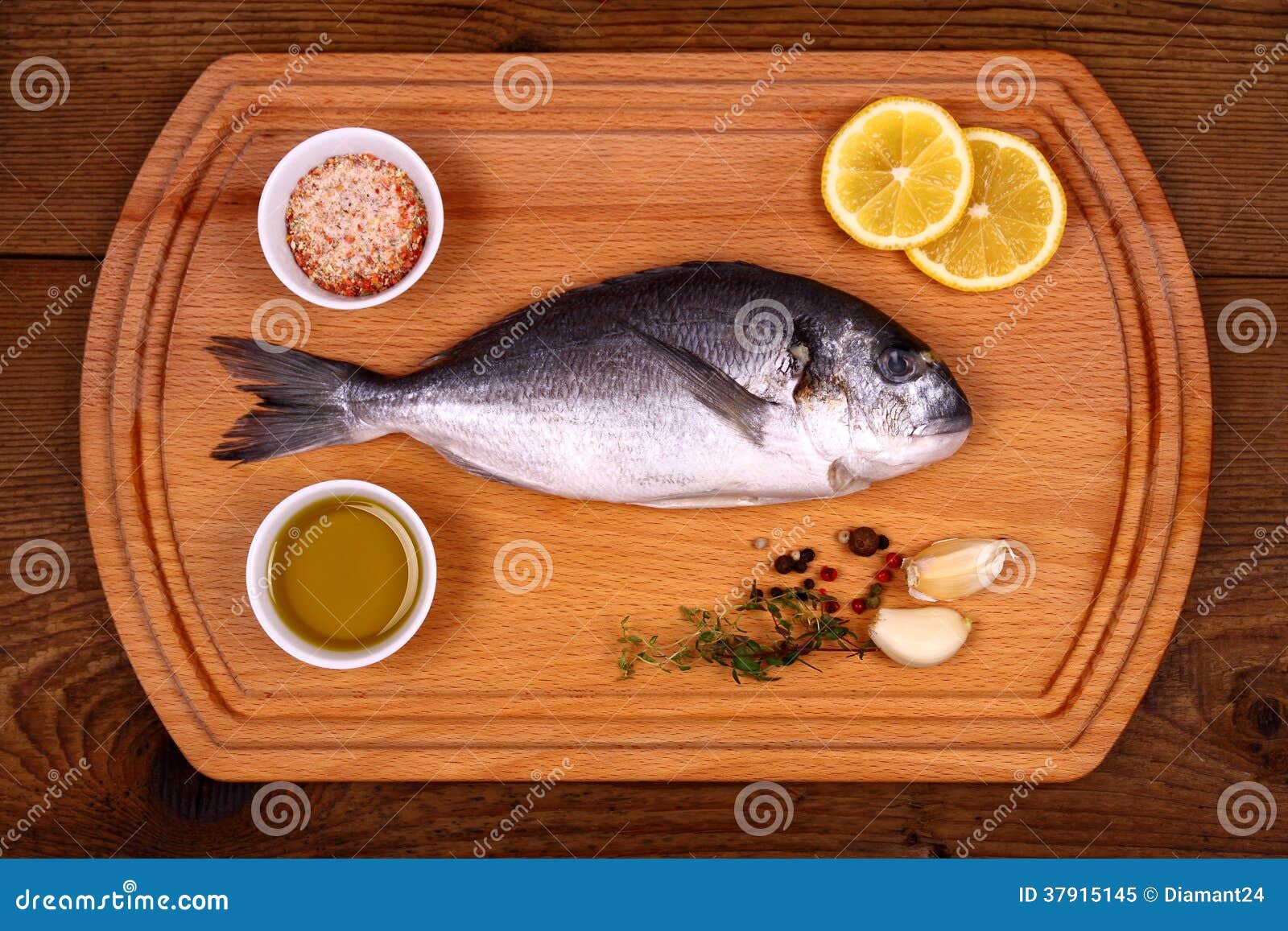 Fresh Bream Fish on Cutting Board with Ingredients Stock Image - Image ...